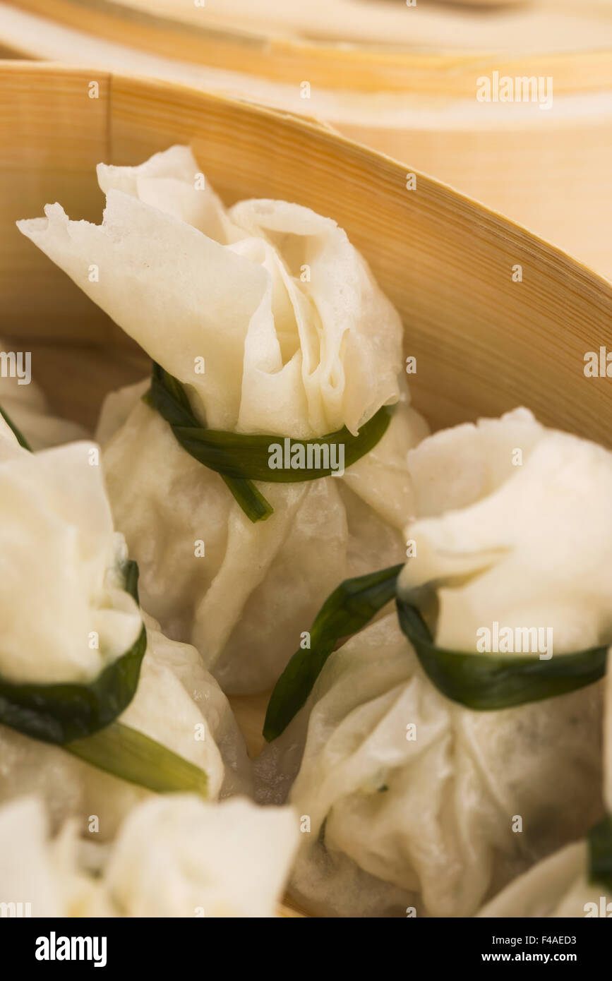 Chinese dumplings in bamboo steamers Stock Photo - Alamy