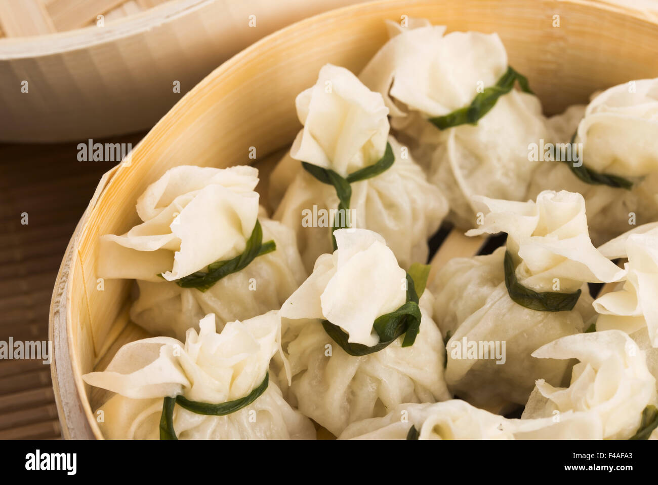 Chinese dumplings in bamboo steamers Stock Photo - Alamy