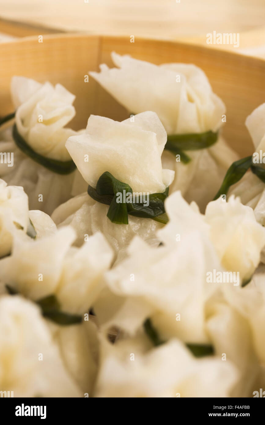Chinese dumplings in bamboo steamers Stock Photo - Alamy