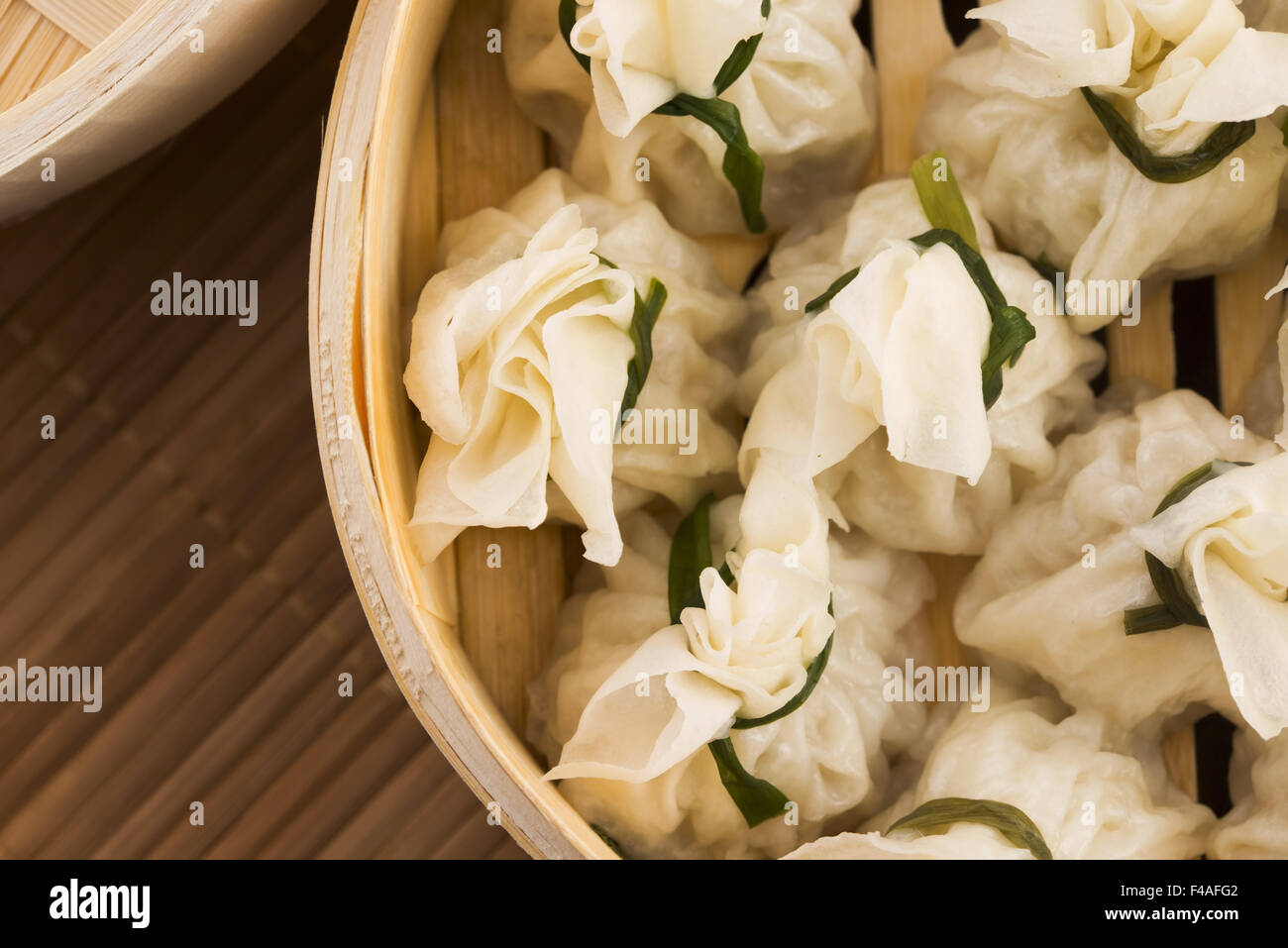 Chinese dumplings in bamboo steamers Stock Photo - Alamy