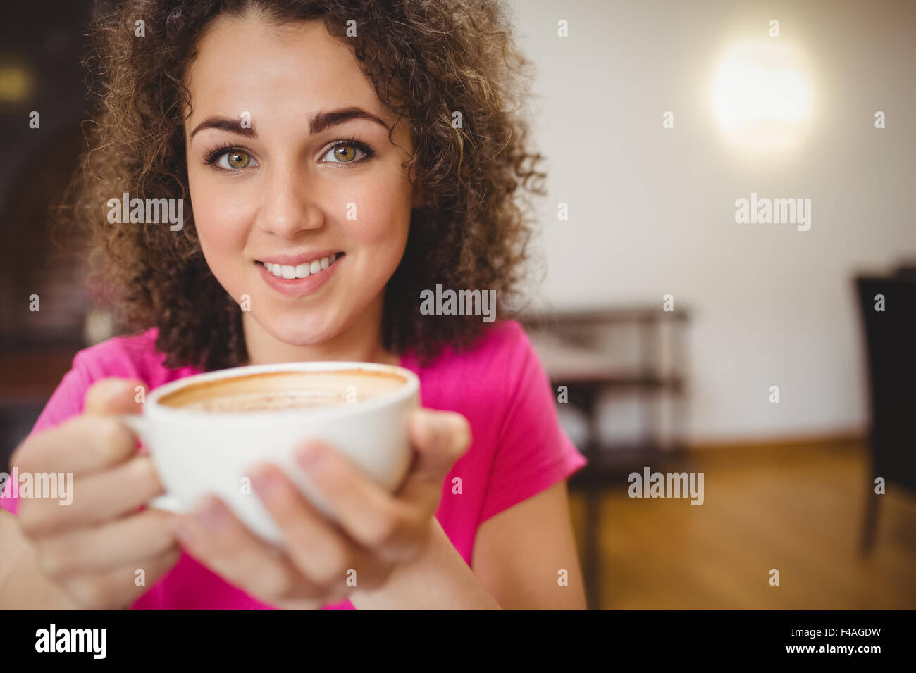 Pretty student having a coffee Stock Photo - Alamy