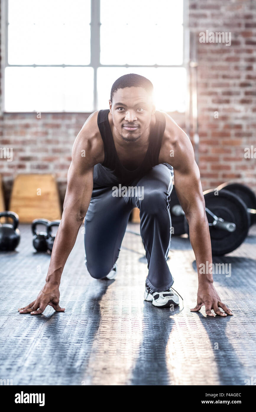 Muscular man doing stretching exercises Stock Photo - Alamy