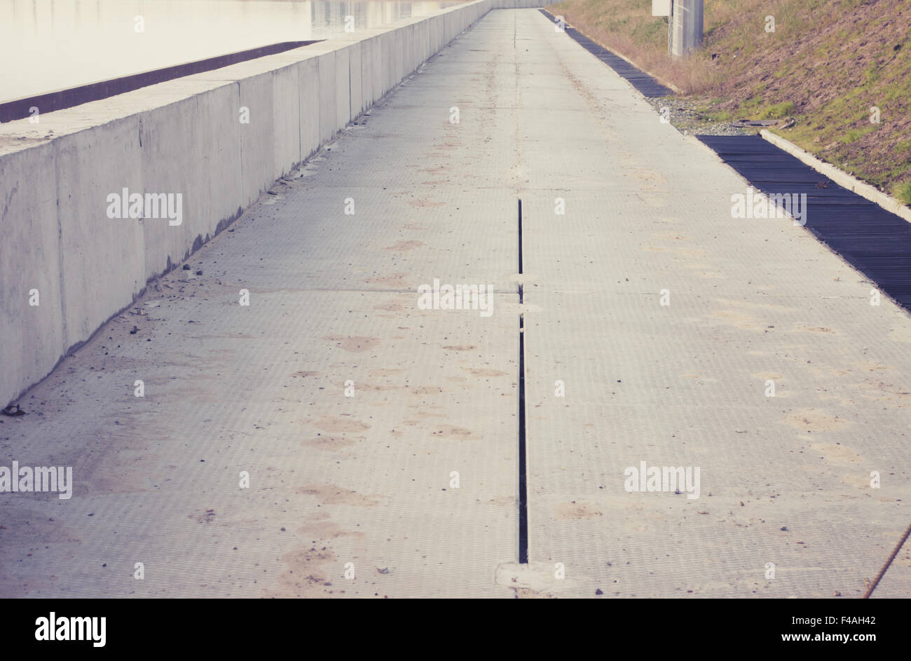 Embankment concrete slabs dam on the river Stock Photo - Alamy