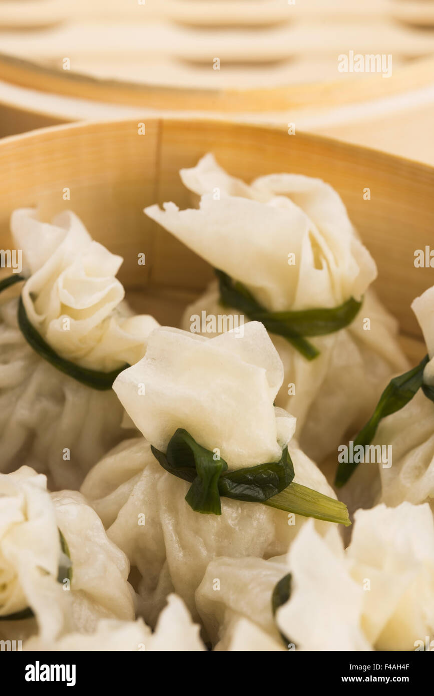 Chinese dumplings in bamboo steamers Stock Photo - Alamy