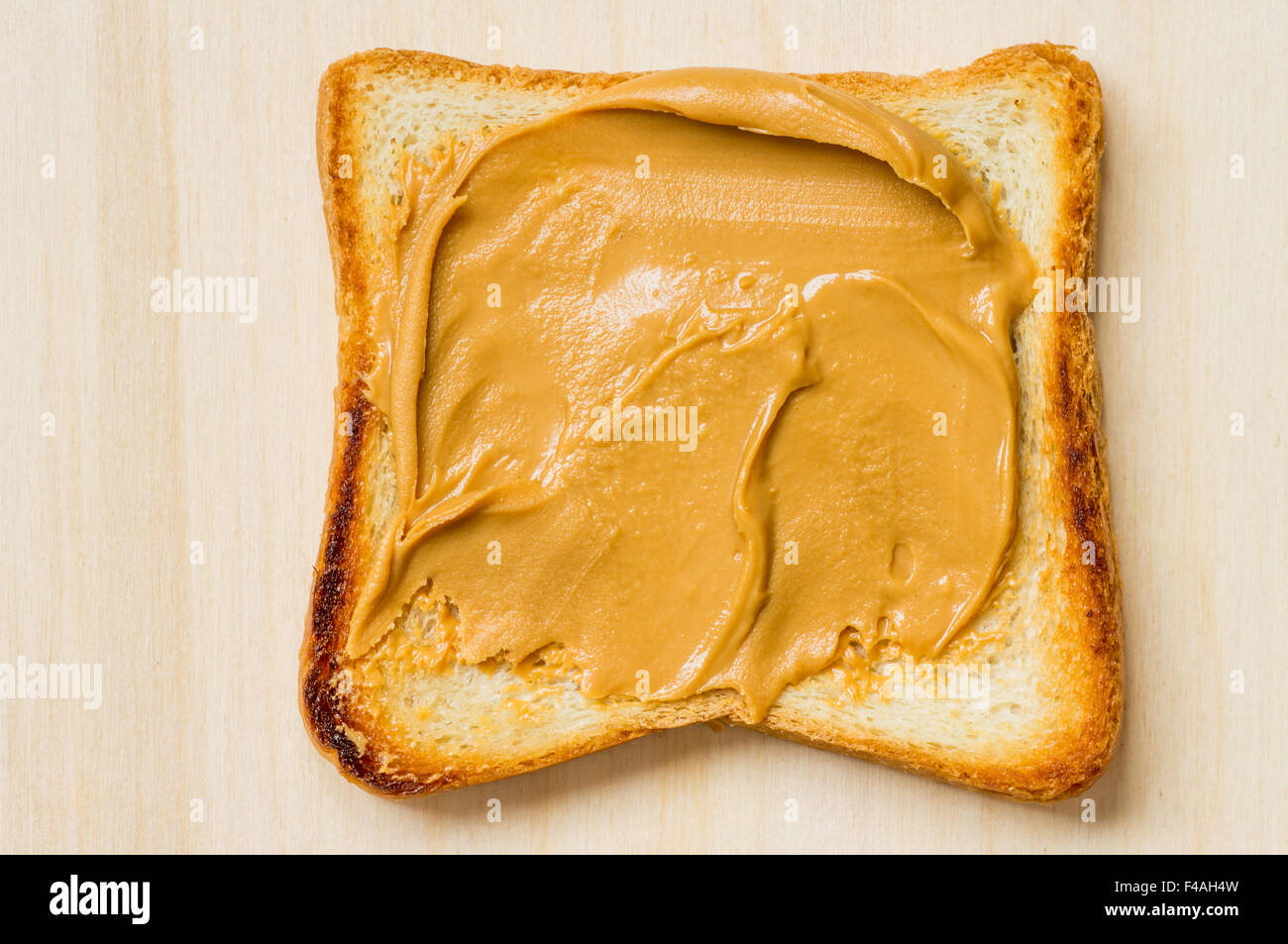 Grilled toast with peanut butter top view Stock Photo - Alamy