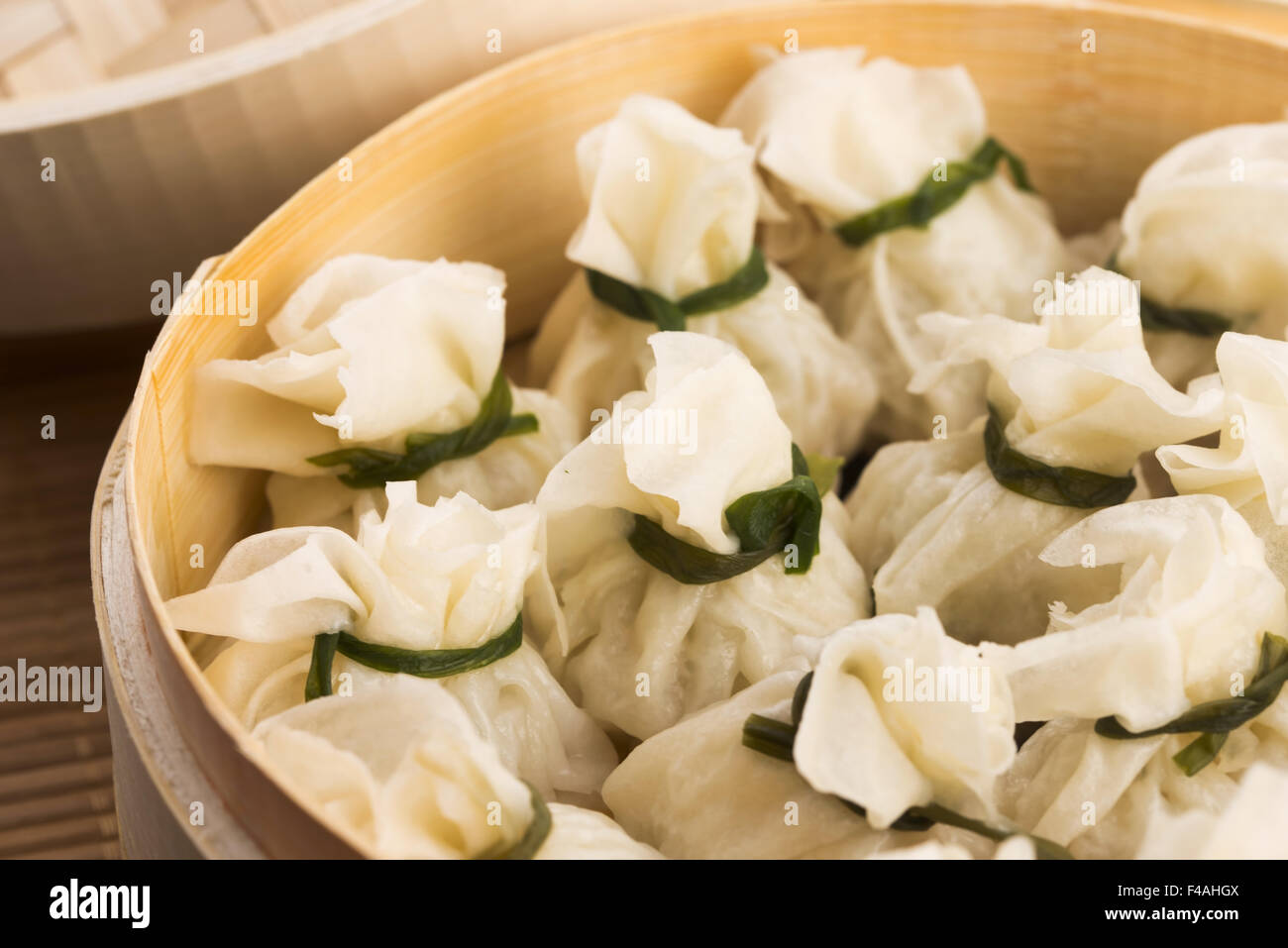 Chinese dumplings in bamboo steamers Stock Photo - Alamy