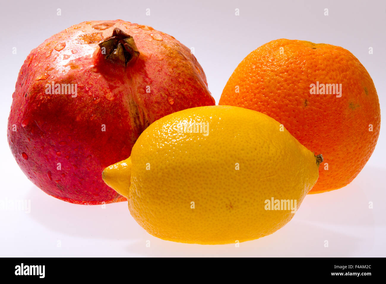orange pomegranate lemon Stock Photo - Alamy
