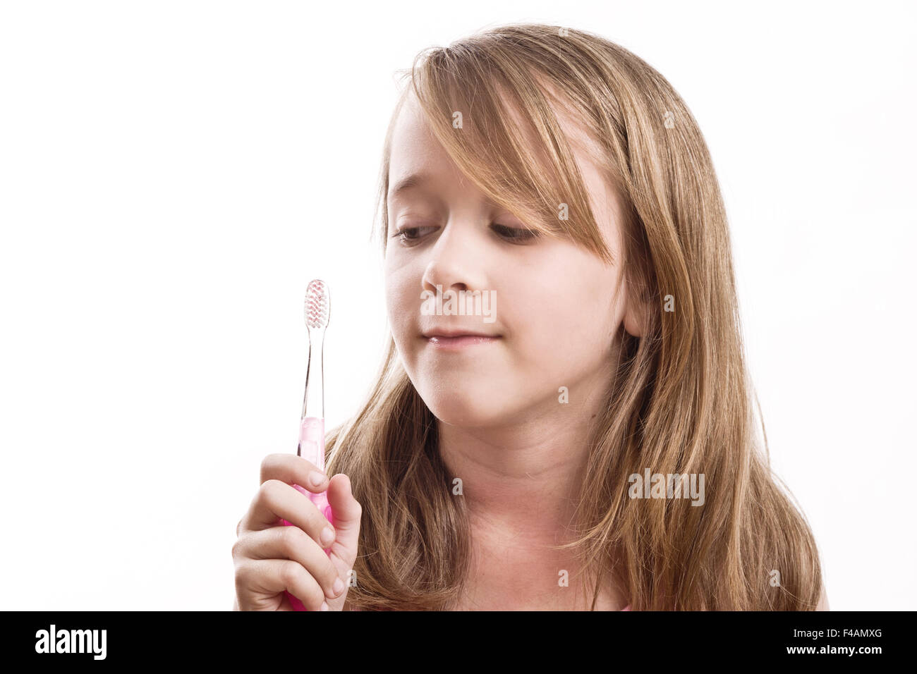 young girl with toothbrush, various dental images, on a white ...
