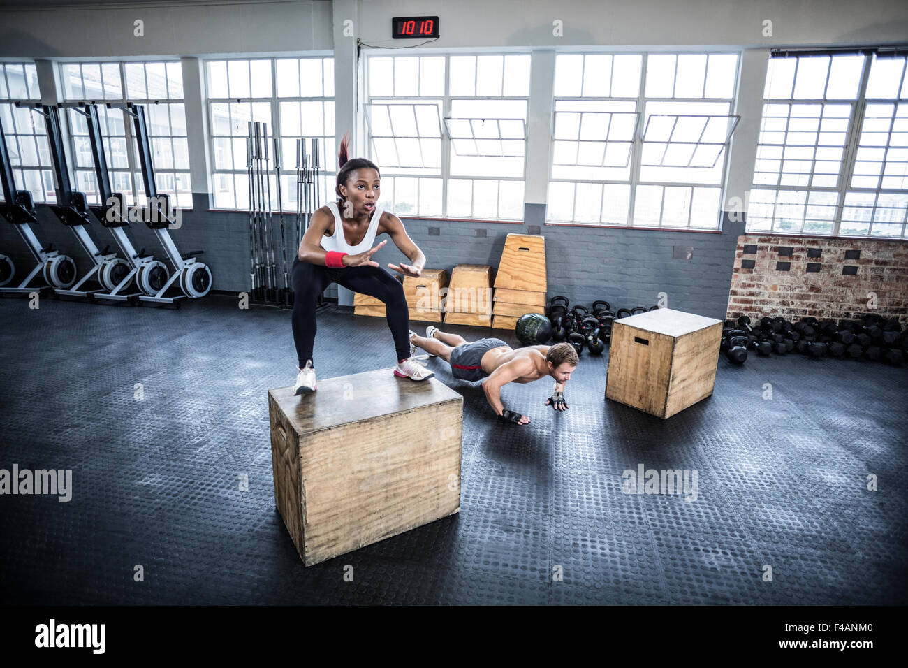 Muscular couple doing some exercises Stock Photo - Alamy