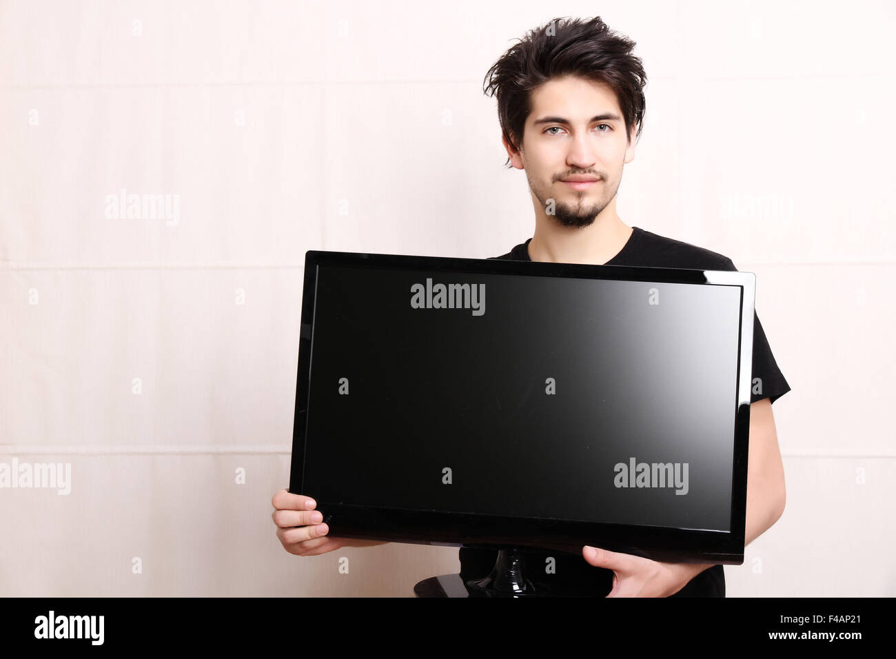 Man with a TV Stock Photo - Alamy