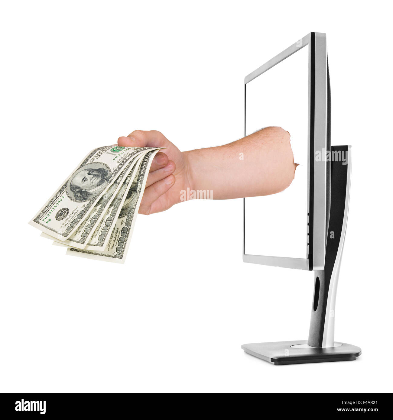Hand with money and computer monitor Stock Photo - Alamy