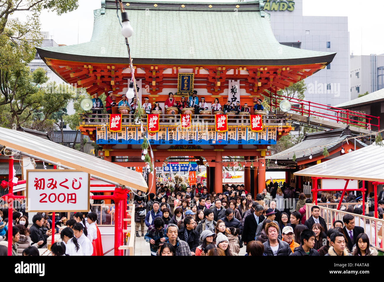 Ikuta shrine, Kobe. New Year. Crowds filling the shrine buying fortune ...