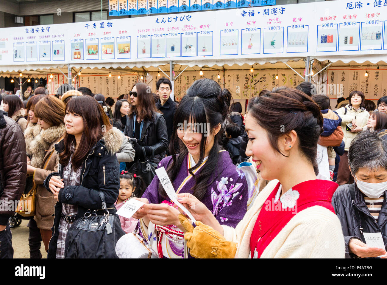 Ikuta Shinto shrine, Japan, during Shogatsu, new year. Three young ...