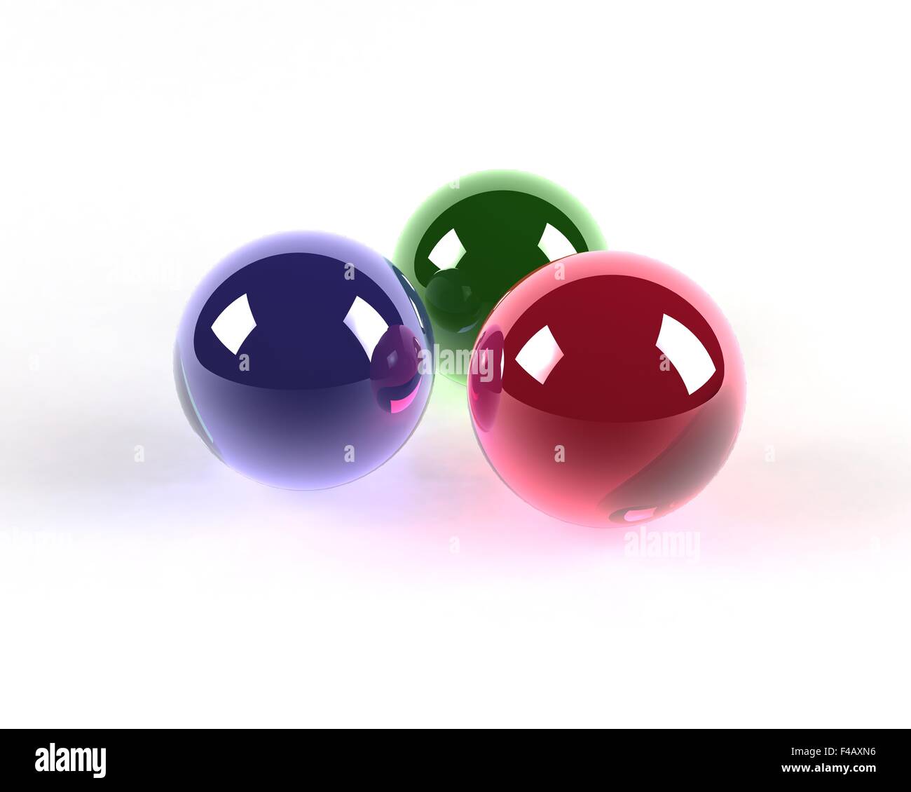 three glass coloured spheres Stock Photo - Alamy