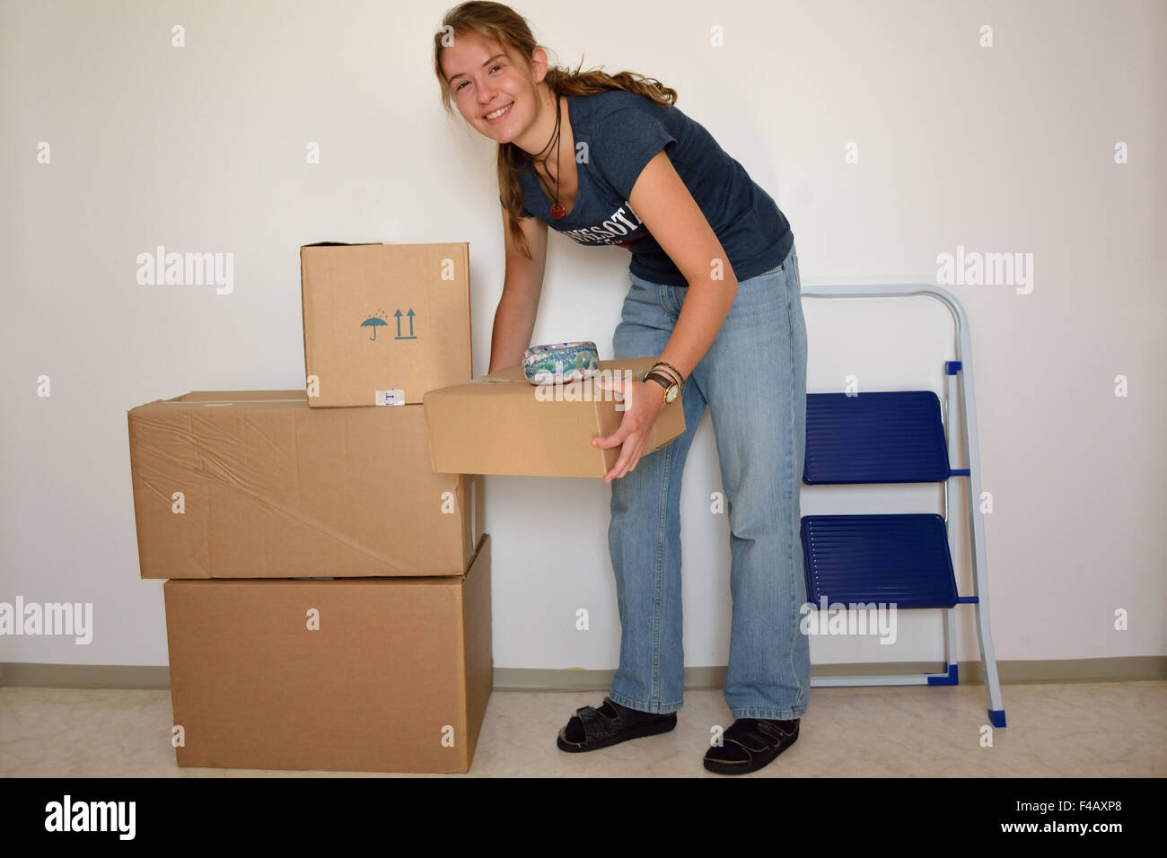 Young woman moves Stock Photo - Alamy
