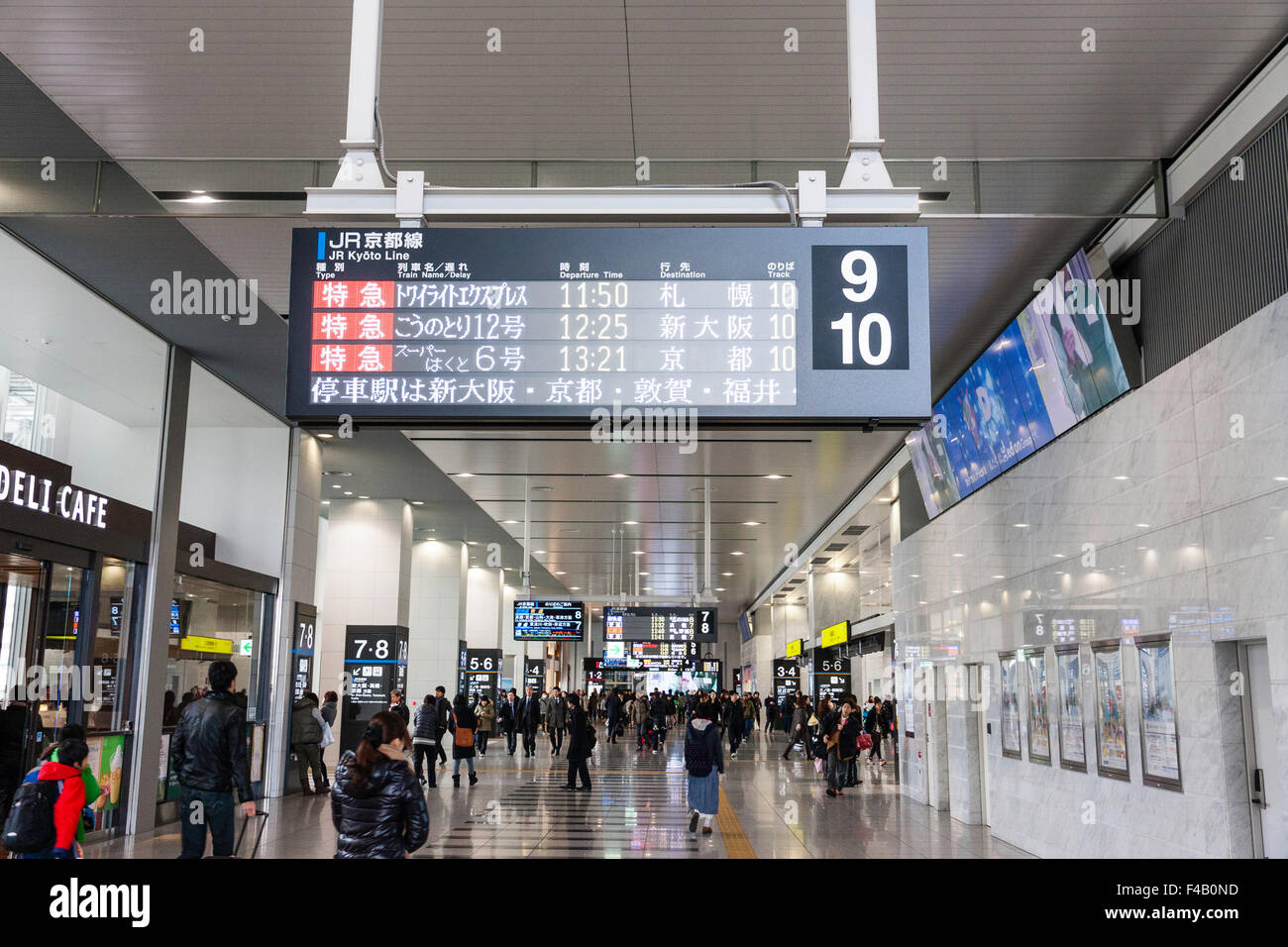 Concourse over platforms at Osaka Station City. Commuters walking ...