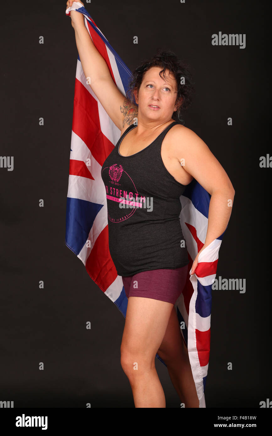 Female boxer in the studio, with British union flag celebrating a ...