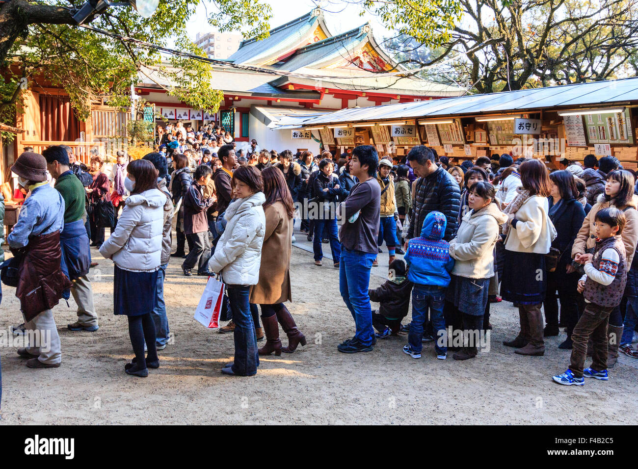 Japan new year at Nishinomiya Shinto shrine. Queue of people waiting in ...
