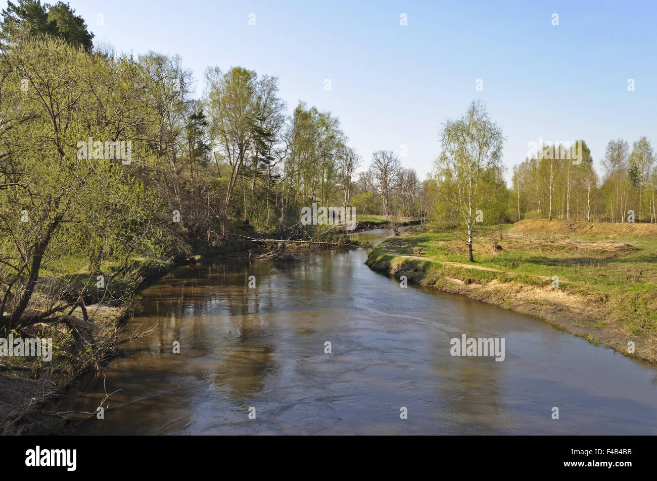 Spring country landscape with small river Stock Photo - Alamy