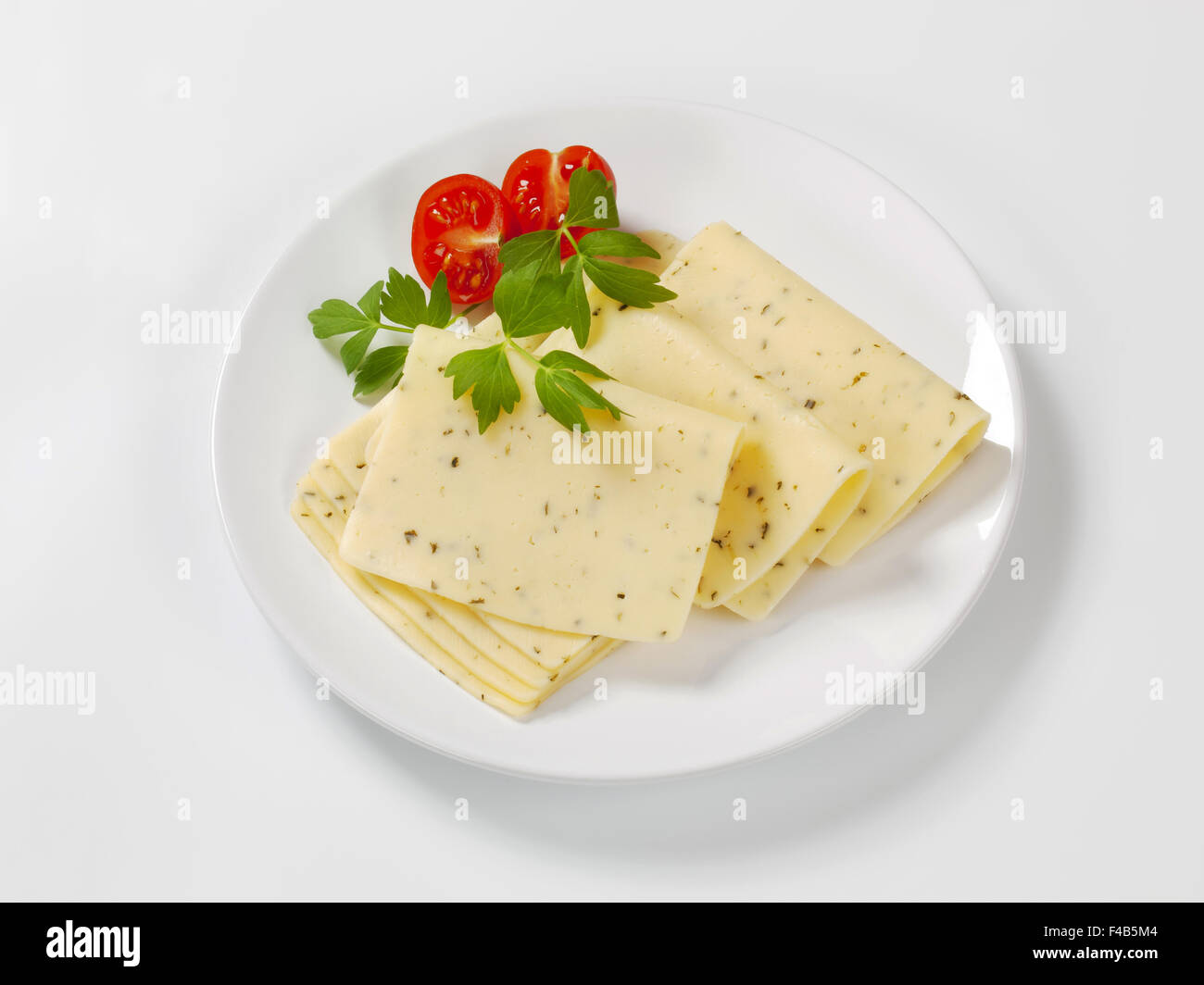 thin sliced cheese flavored with herbs Stock Photo - Alamy