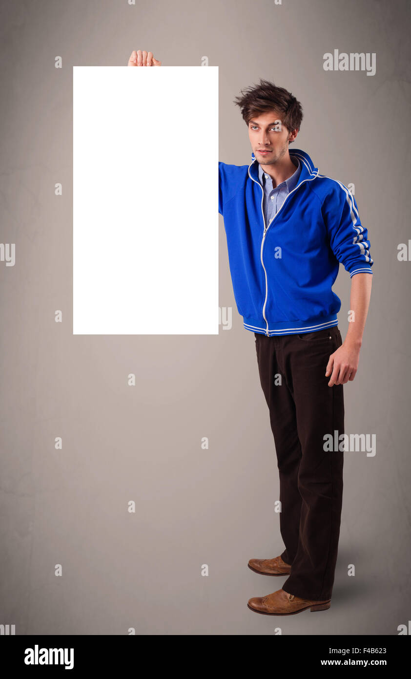 Young boy presenting white paper copy space Stock Photo - Alamy