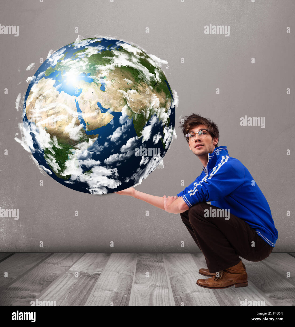 Good-looking man holding 3d planet earth Stock Photo - Alamy