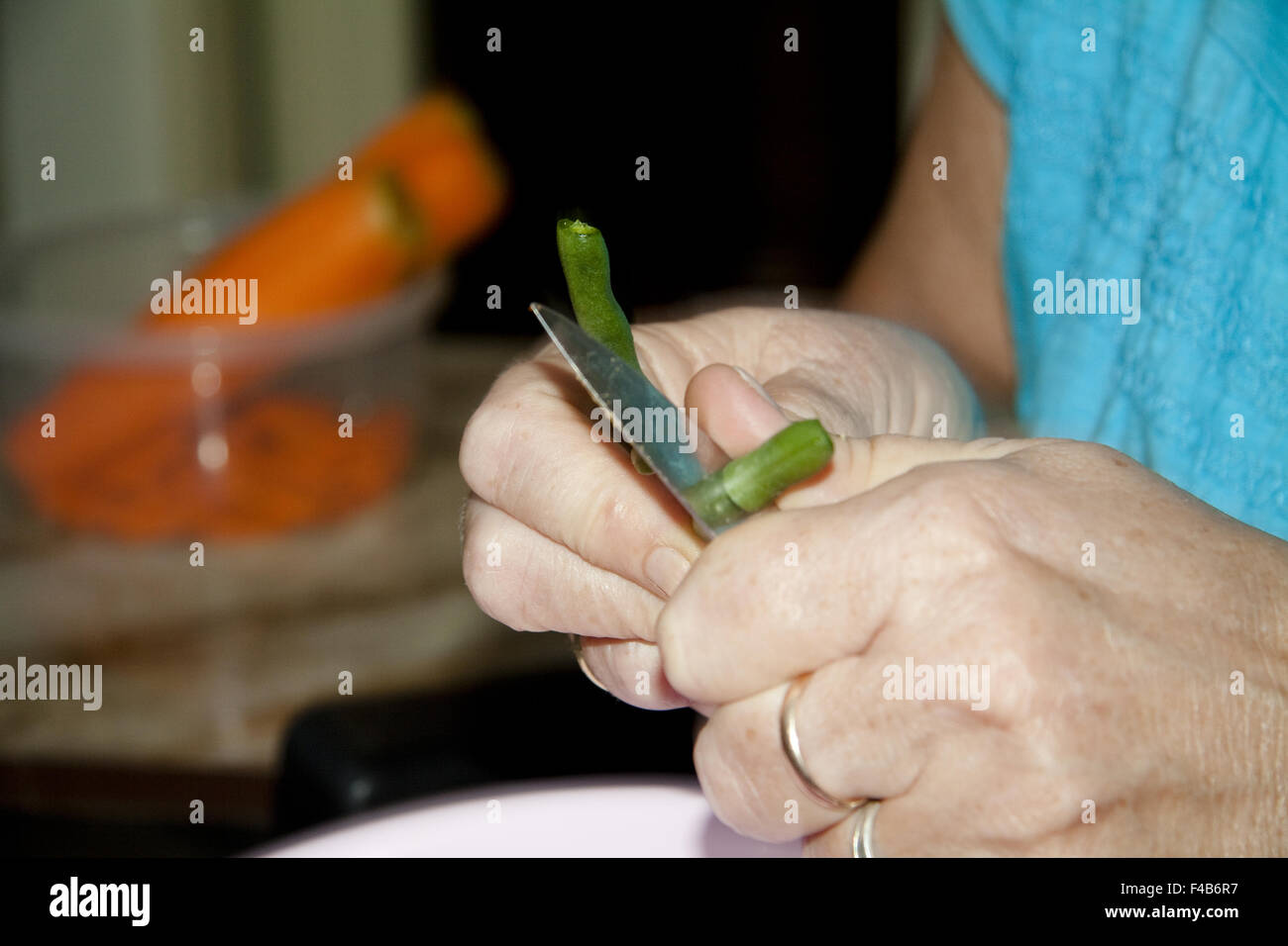 Stick beans and knives in the hand Stock Photo - Alamy