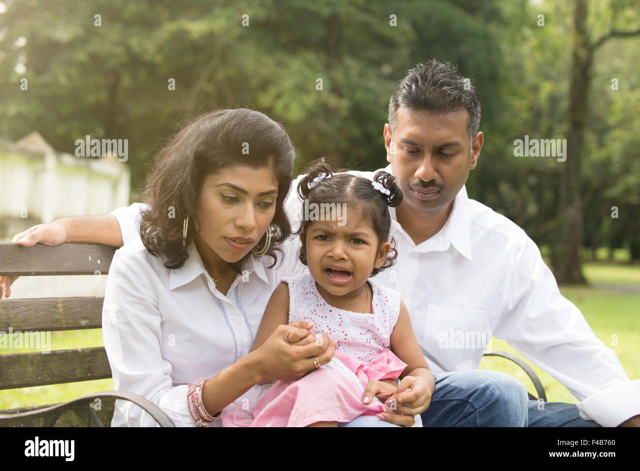 indian parent dealing with daughter with tantrum Stock Photo - Alamy