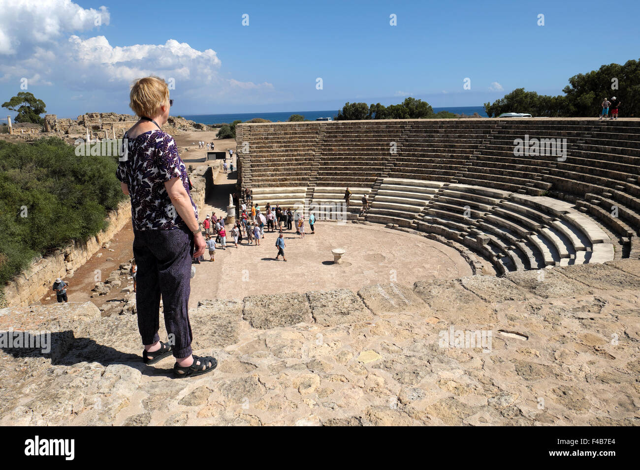 Rear back view of senior woman tourist standing looking at the ...