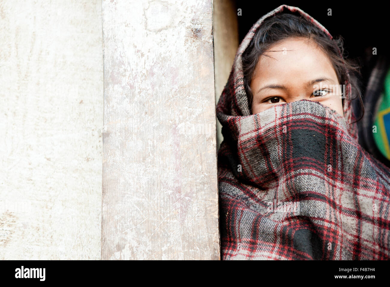 Girl with covered face in Jumla Nepal Stock Photo - Alamy