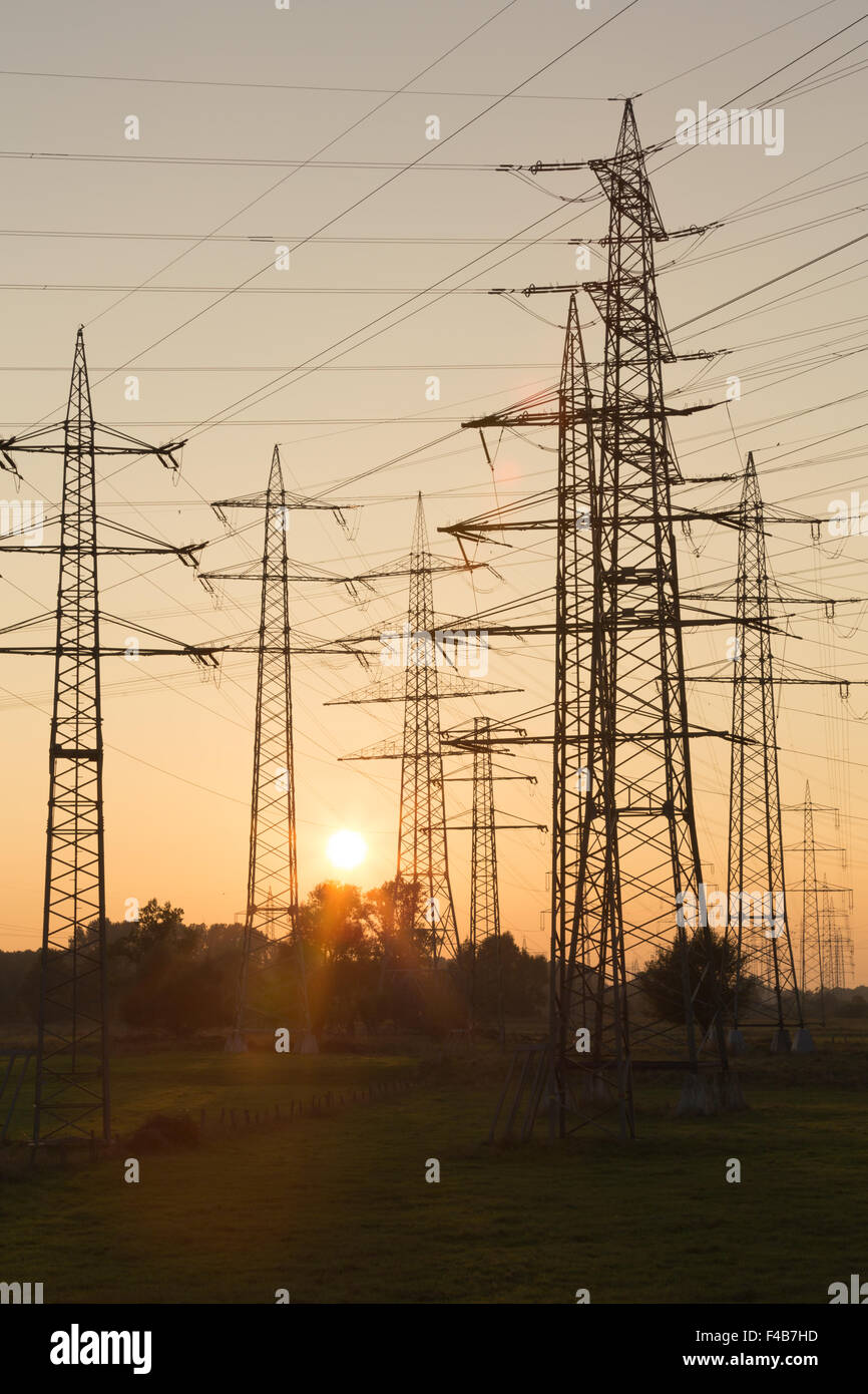Overhead cables in a sundown landscape 2 Stock Photo - Alamy