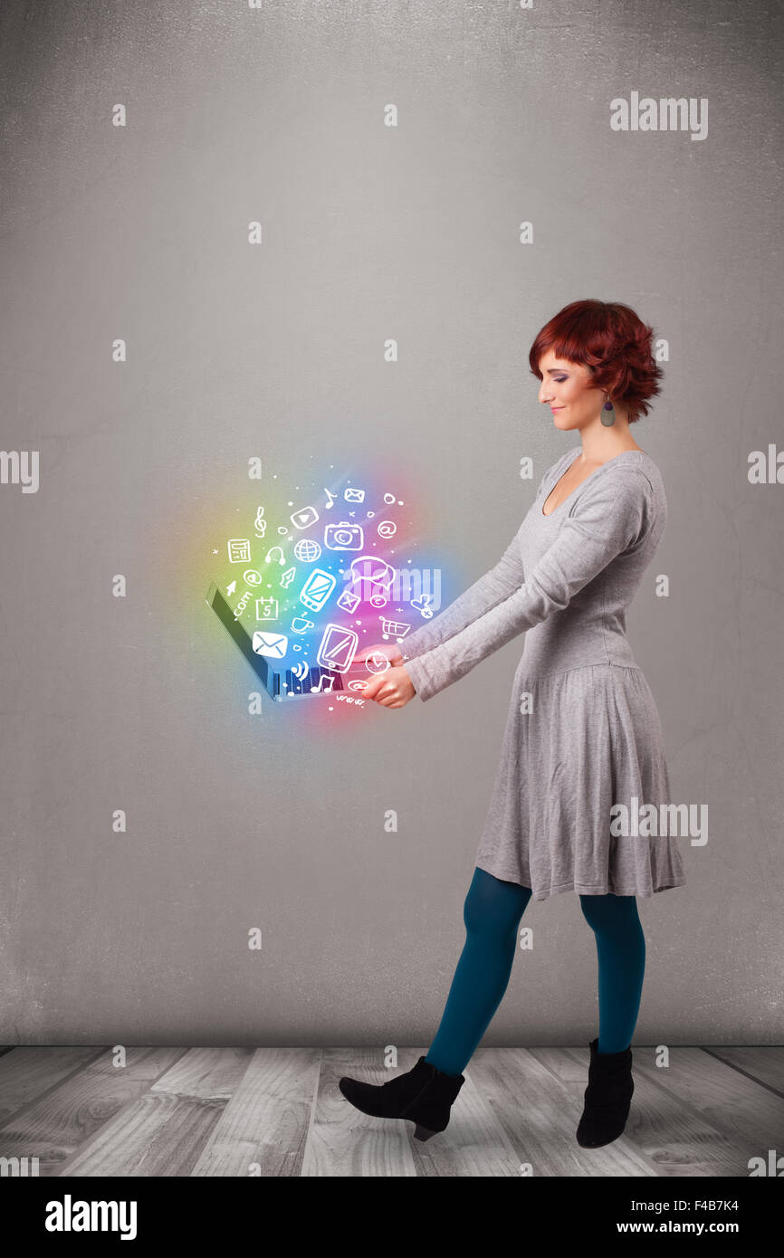 Young lady holding notebook with colorful hand drawn multimedia icons ...