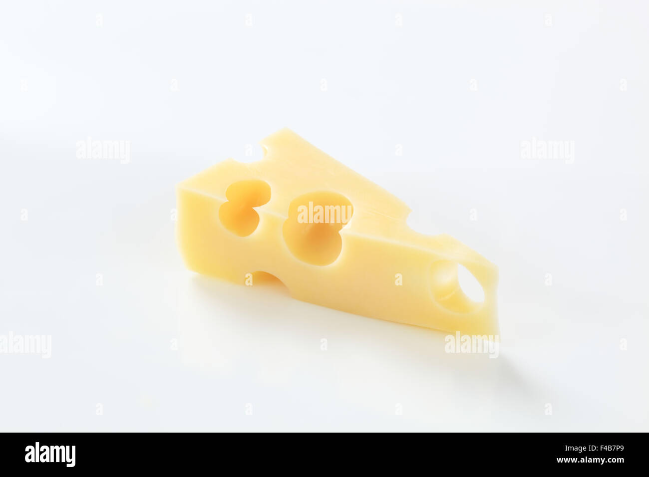 a wedge of fresh Swiss cheese Stock Photo - Alamy