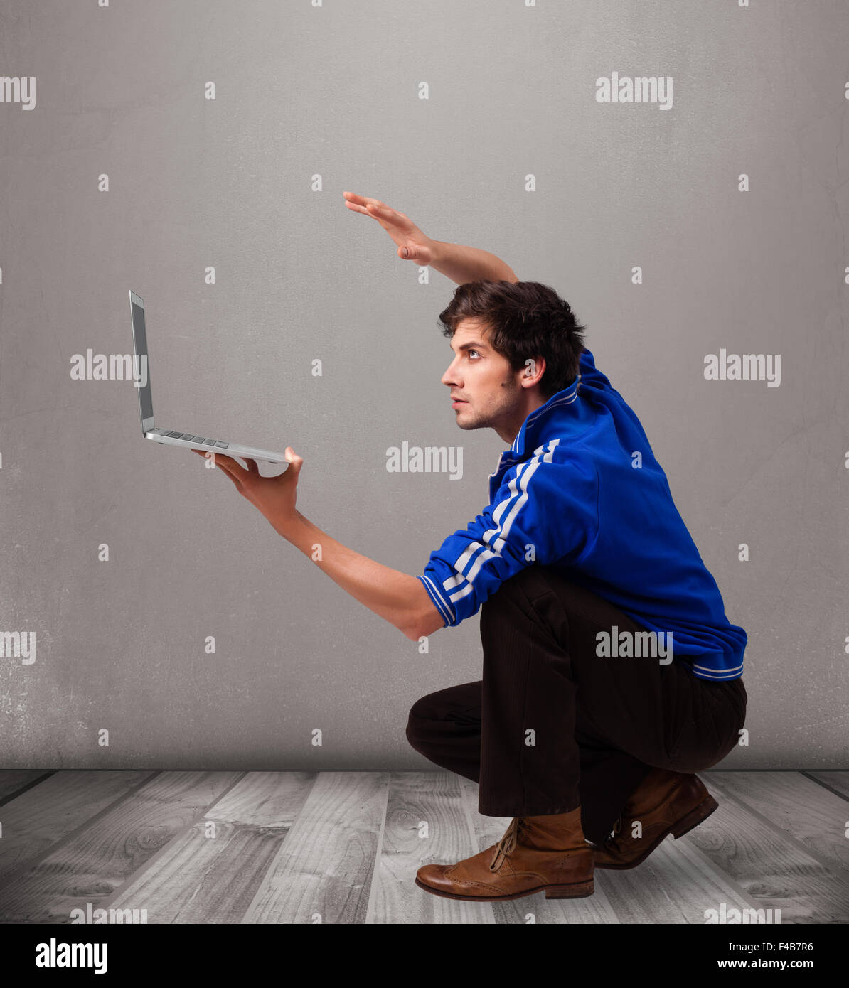 Attractive man holding modern notebook Stock Photo - Alamy