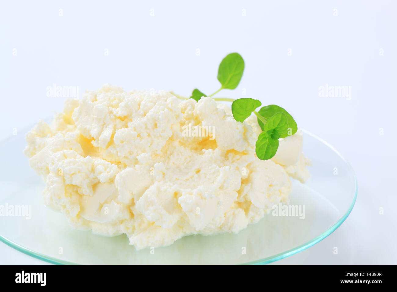 creamy curd cheese on a small glass plate Stock Photo - Alamy