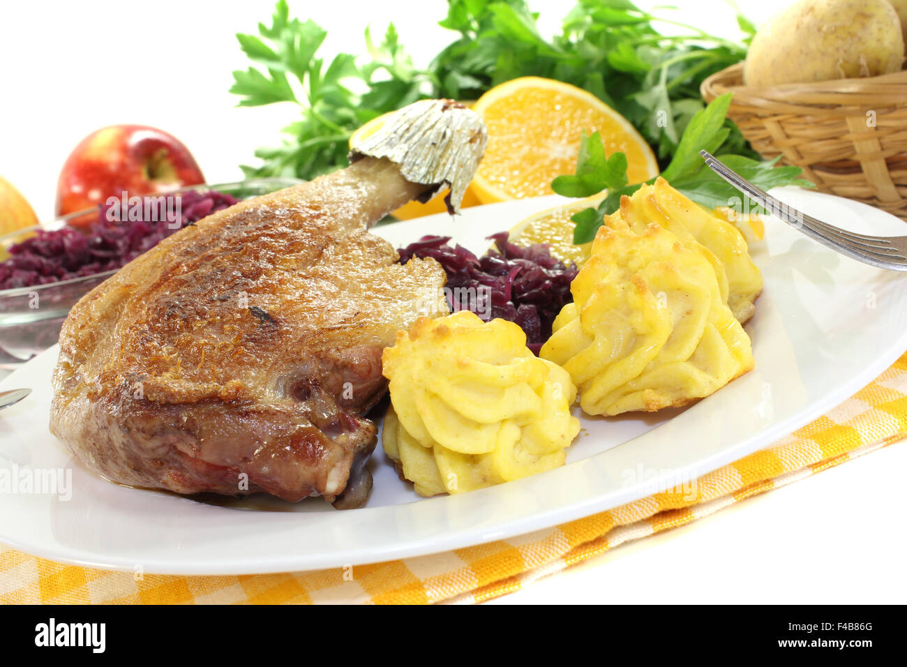 duck drumstick with red cabbage Stock Photo - Alamy