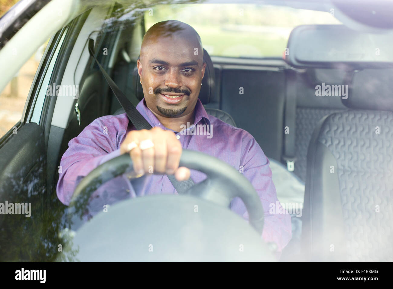 a young man driving his car Stock Photo - Alamy
