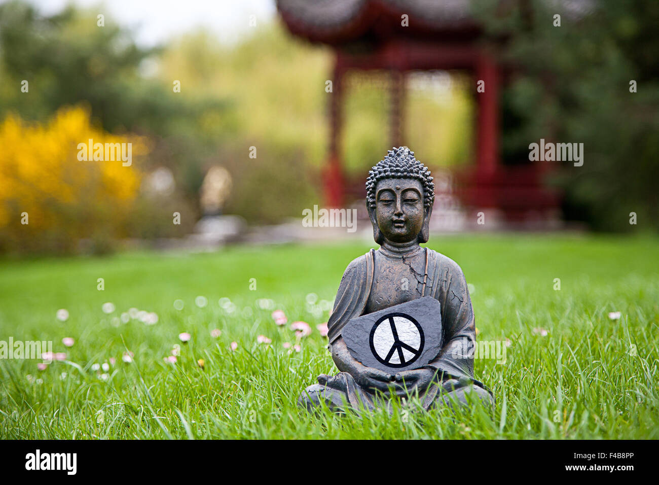 The Peace Sign with Buddha Statue Stock Photo - Alamy