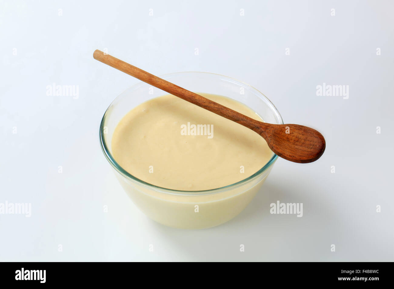 bowl of raw batter and wooden spoon Stock Photo - Alamy