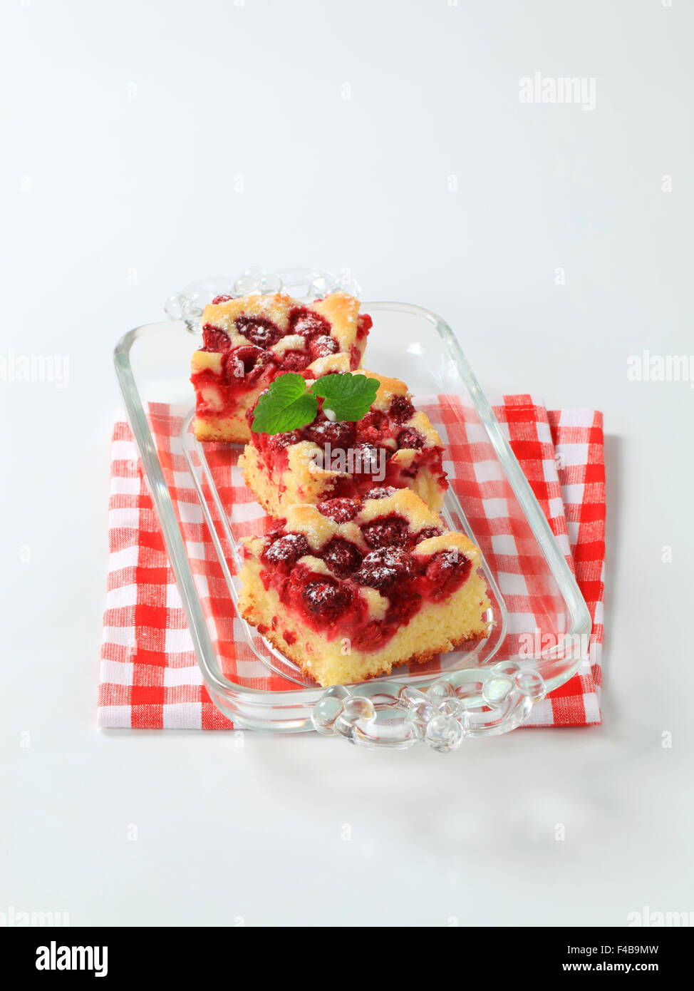 raspberry sponge cake squares on glass tray Stock Photo - Alamy