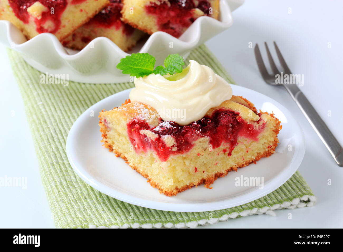 raspberry sponge cake slice with vanilla cream Stock Photo - Alamy