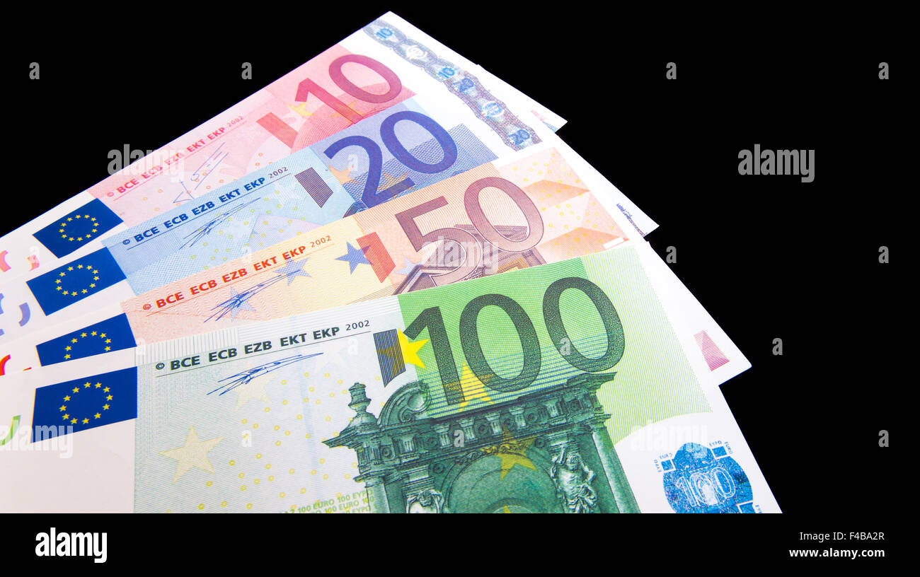 Various euro notes. All on black background Stock Photo - Alamy