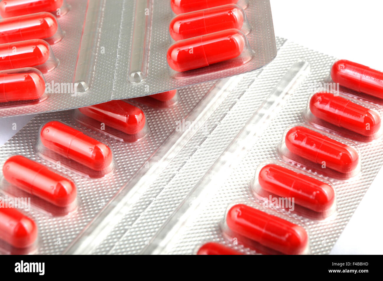 Red Medical Capsules Stock Photo - Alamy