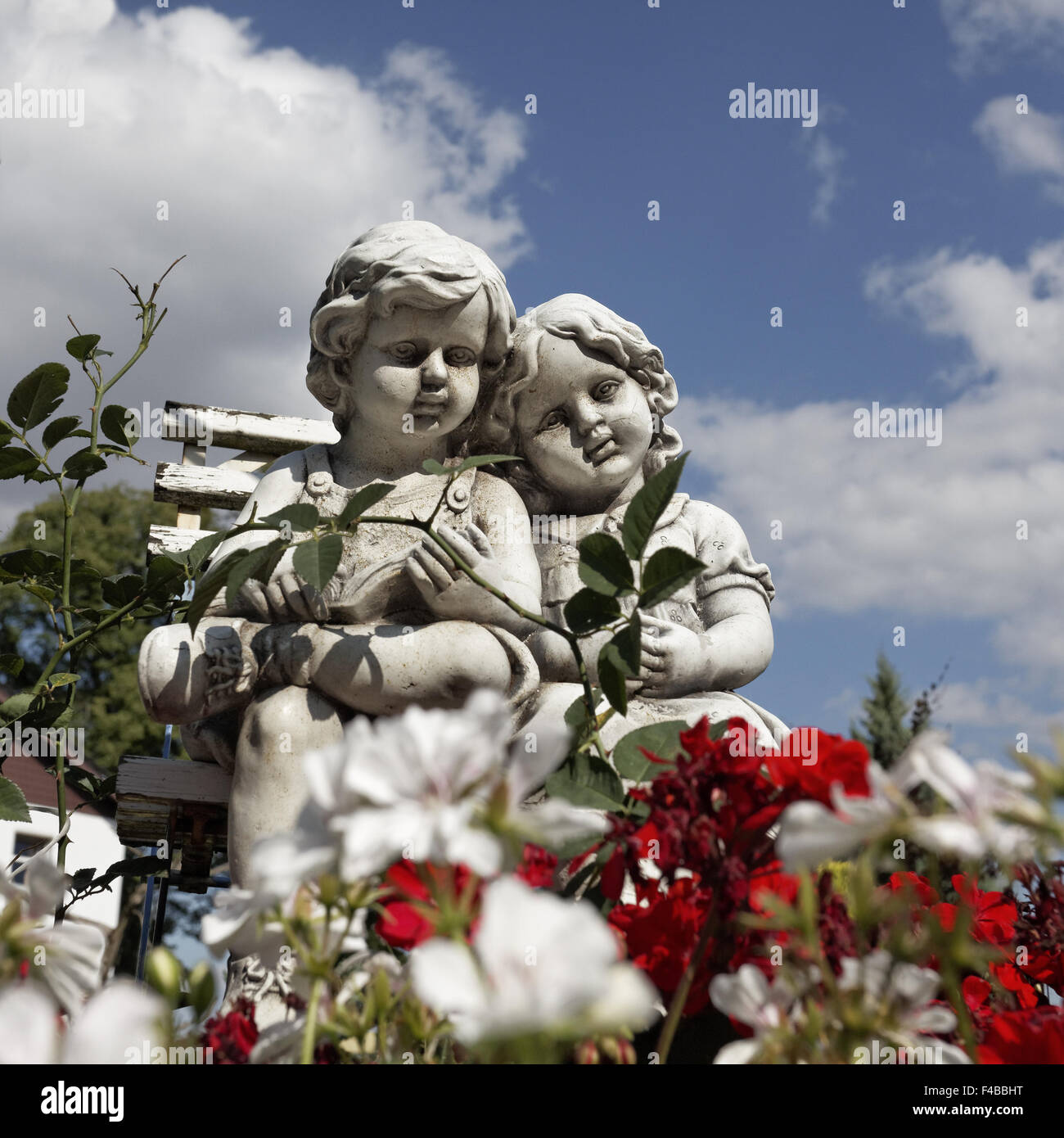 Angel with roses in a garden in Germany Stock Photo - Alamy