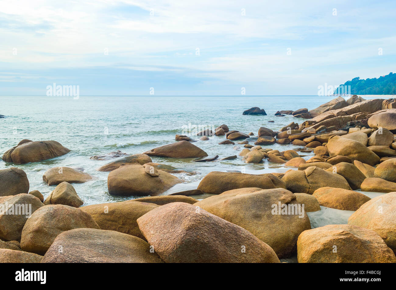 Rock beach at sea shore Stock Photo - Alamy
