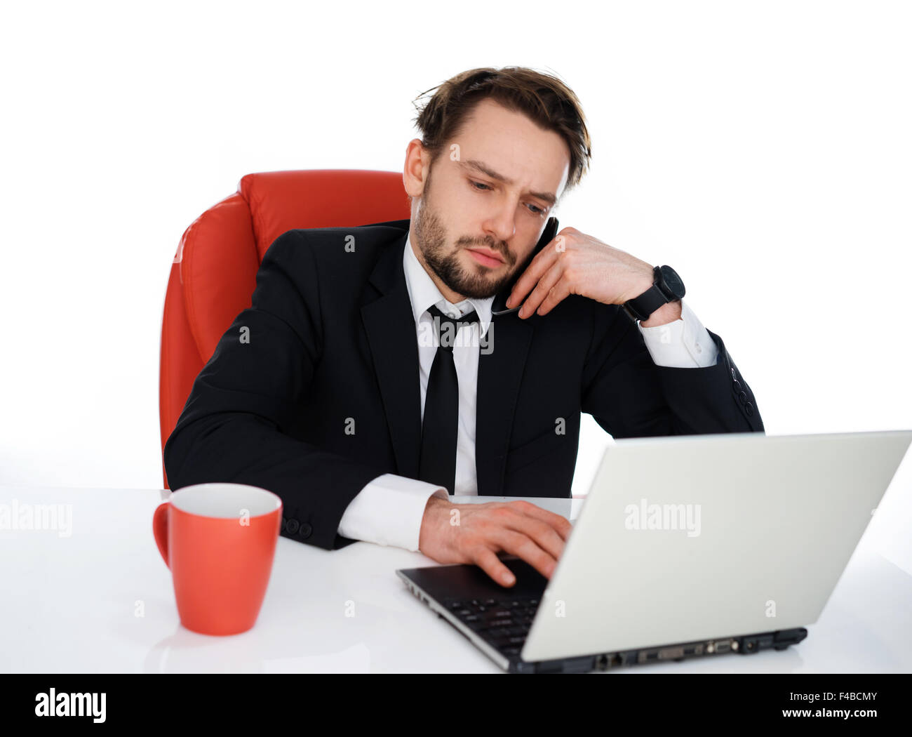Young businessman working on his laptop Stock Photo - Alamy