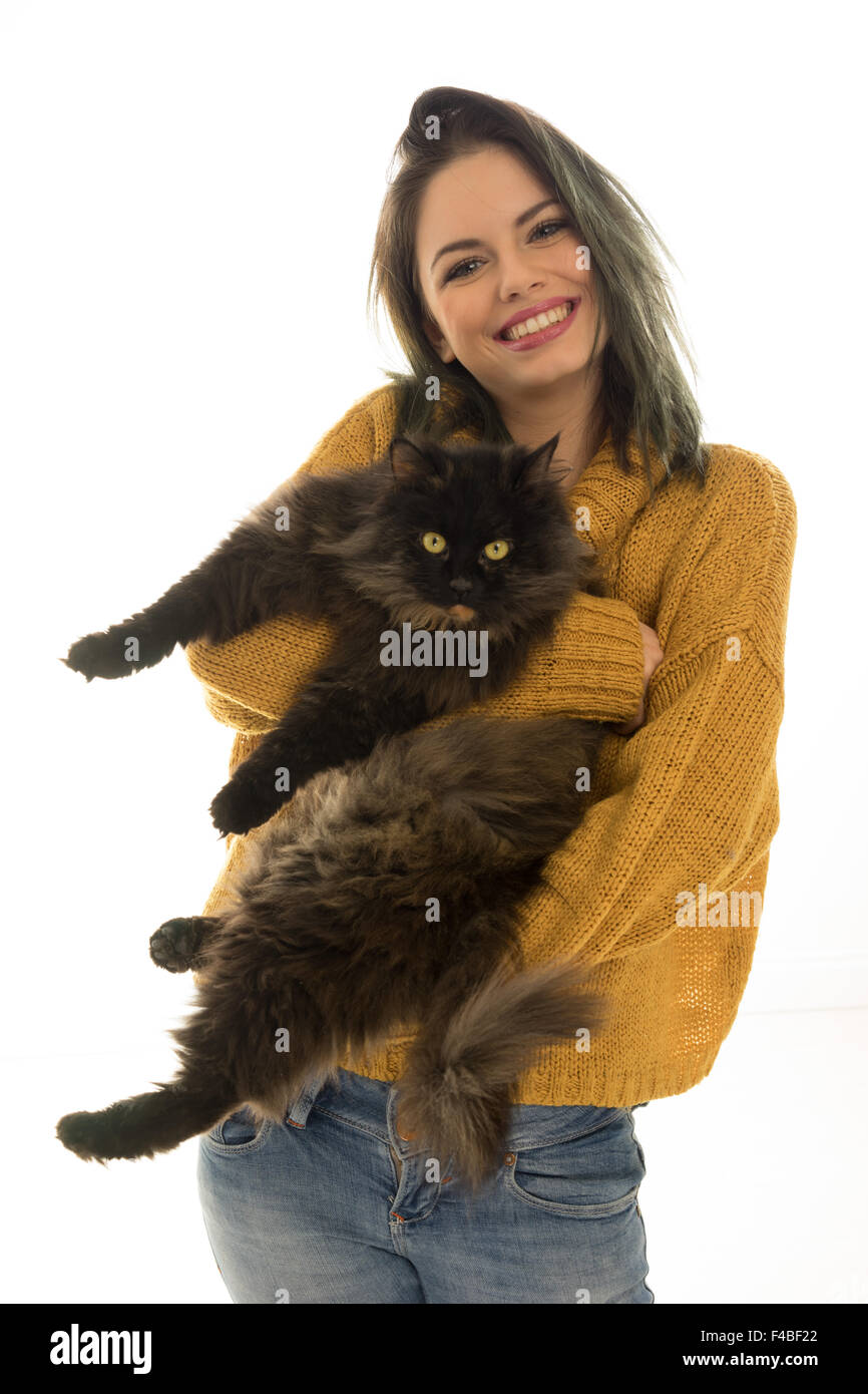 Beautiful woman carrying her cat Stock Photo - Alamy