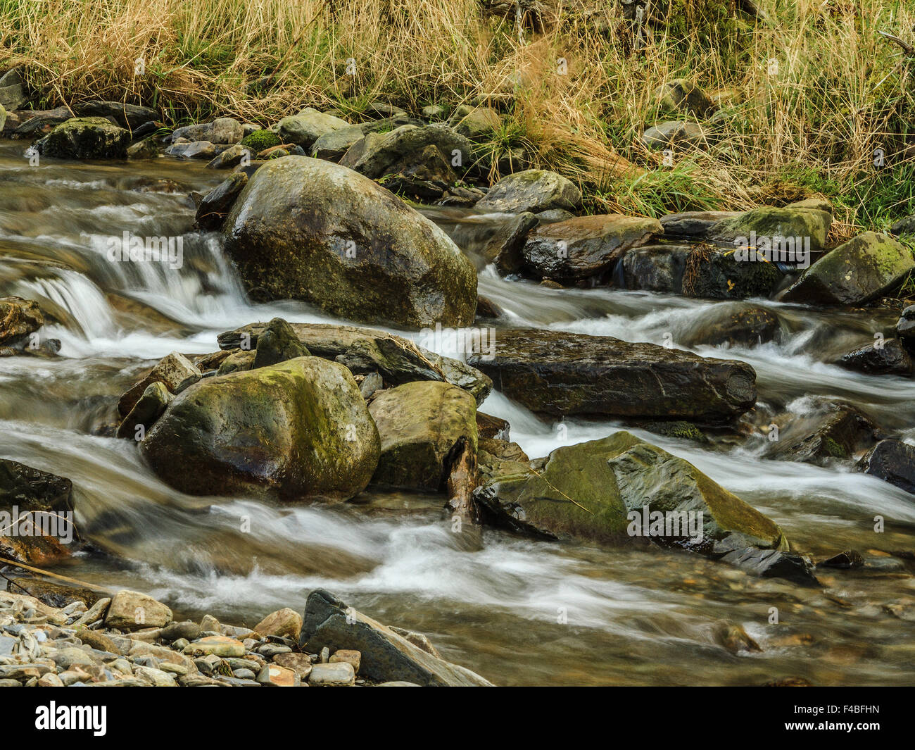 Water over stones hi-res stock photography and images - Alamy