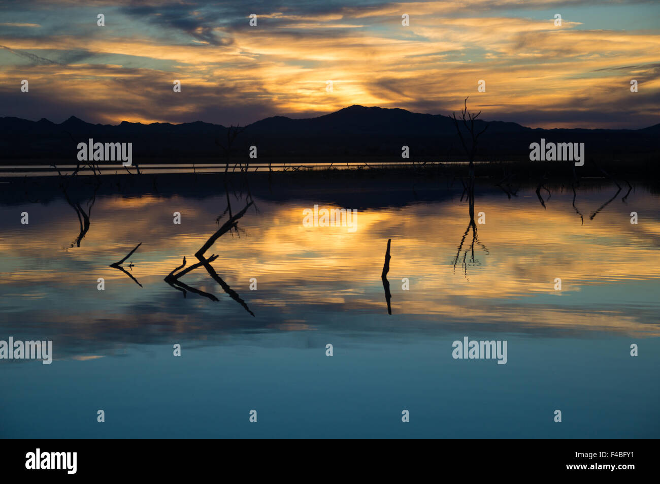 Sunset reflects on lake Stock Photo - Alamy