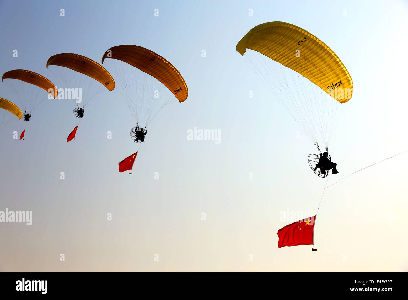 Pucheng, China's Shaanxi Province. 16th Oct, 2015. Parachutists perform ...